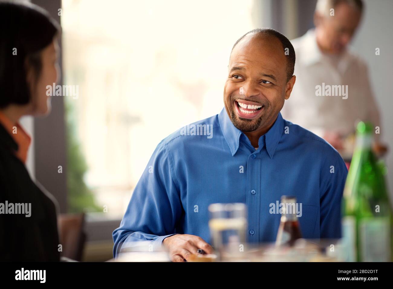 Smiling boss interviews a potential employee over lunch Stock Photo - Alamy