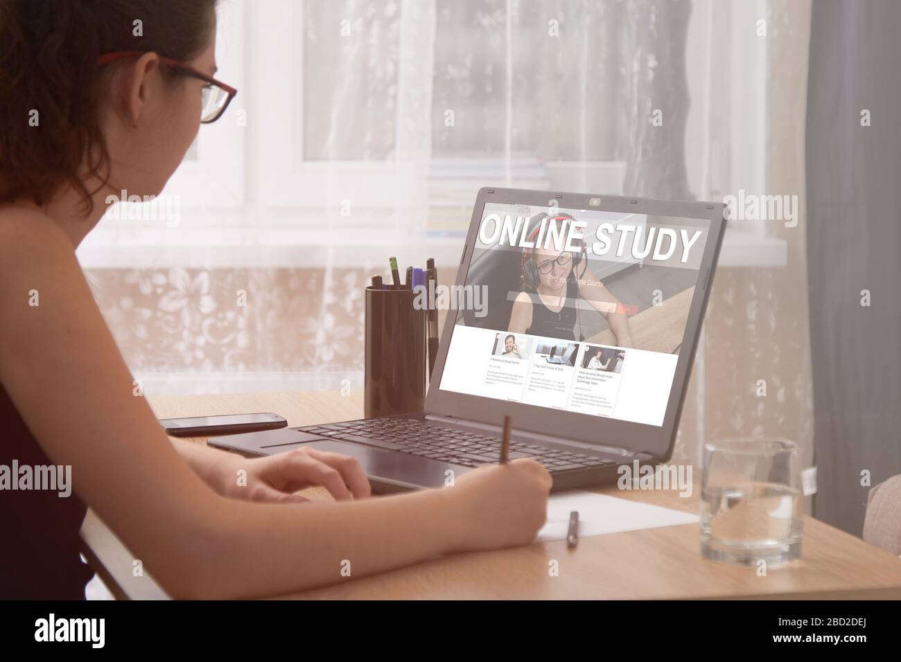 Home environment a young girl with glasses is studying online Stock ...