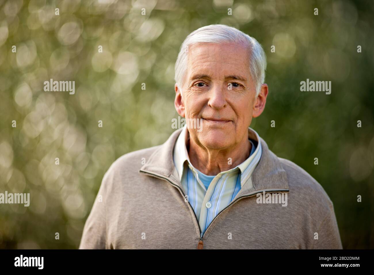 Senior man standing outside Stock Photo - Alamy