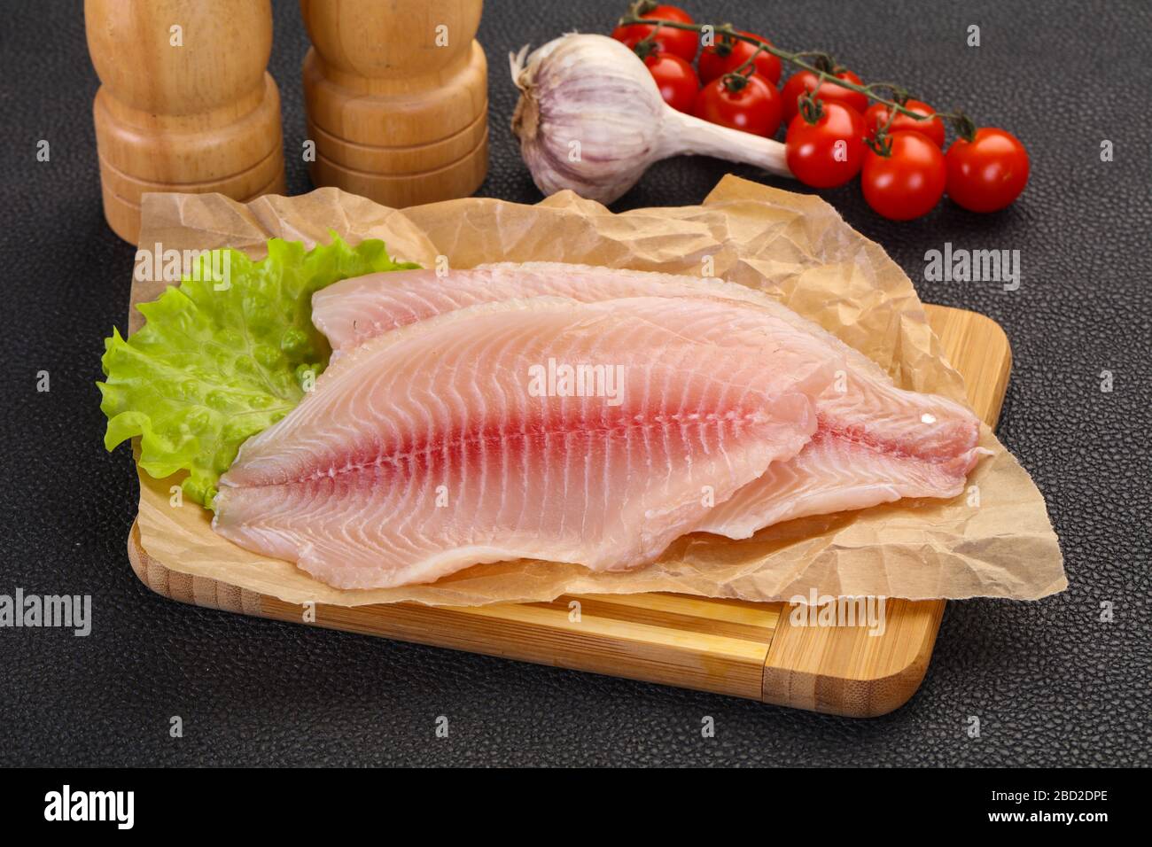 Raw tilapia fish ready for cooking Stock Photo - Alamy