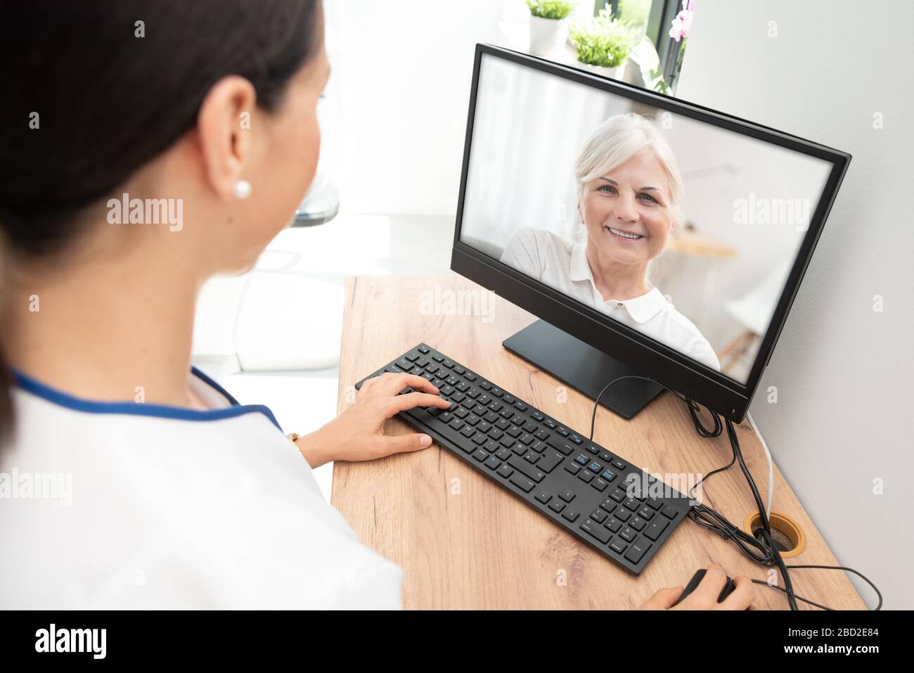 Doctor and senior woman patient medical consultation, telehealth ...