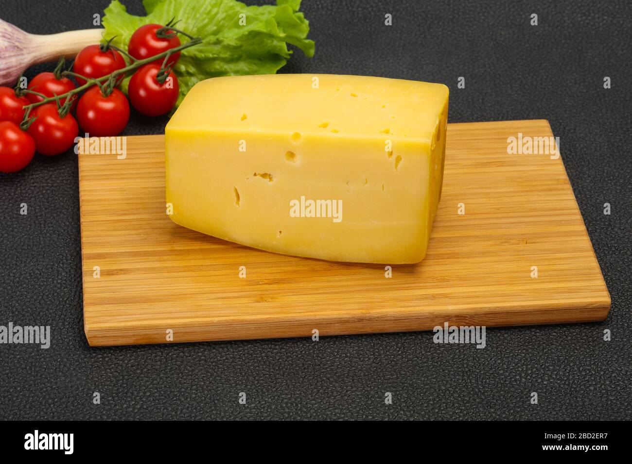 Swiss Hard yellow tasty cheese brick Stock Photo - Alamy