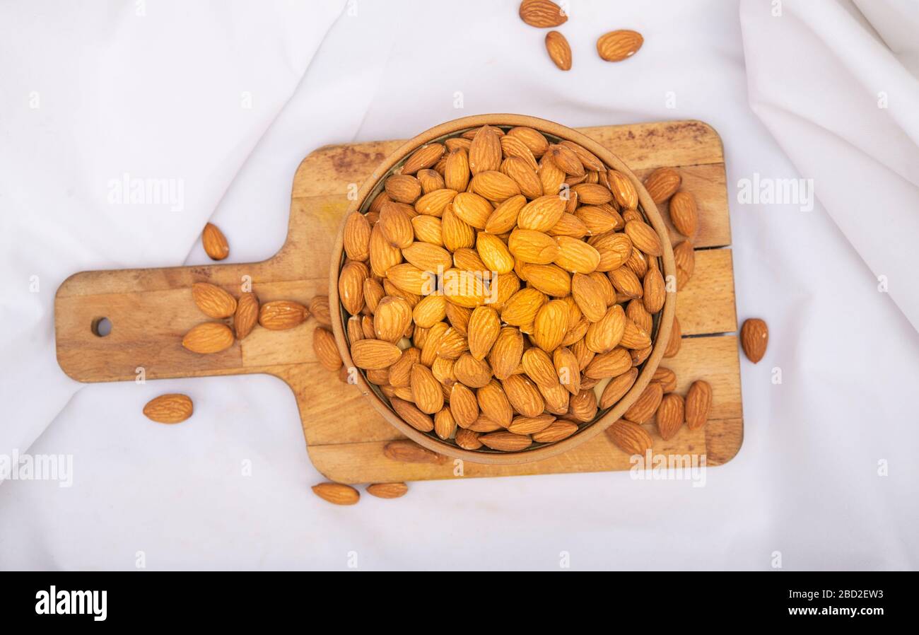 Natural fresh almonds on kitcken table with white background Stock ...