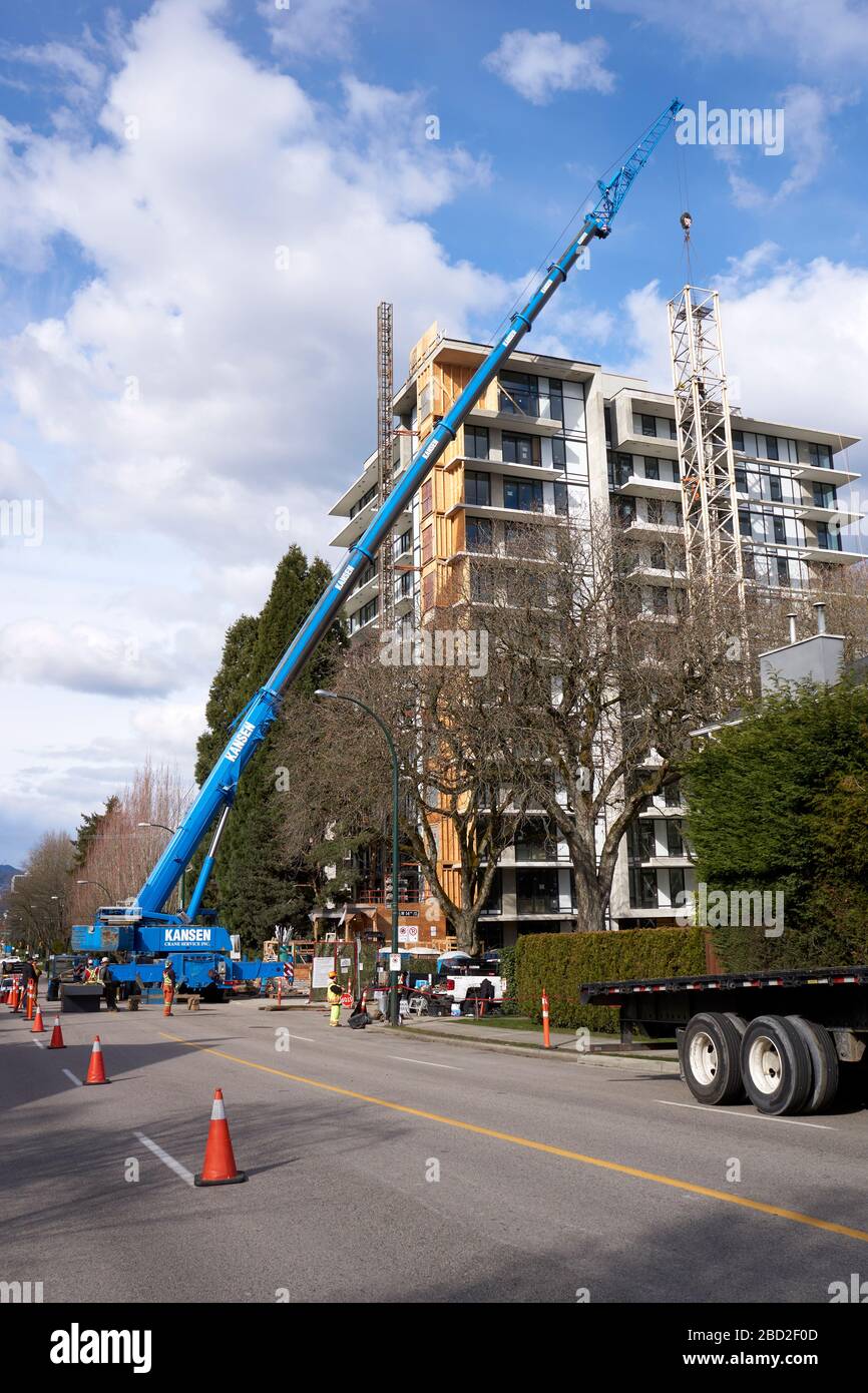 A tall telescopic crane at a construction site in Vancouver, BC, Canada ...