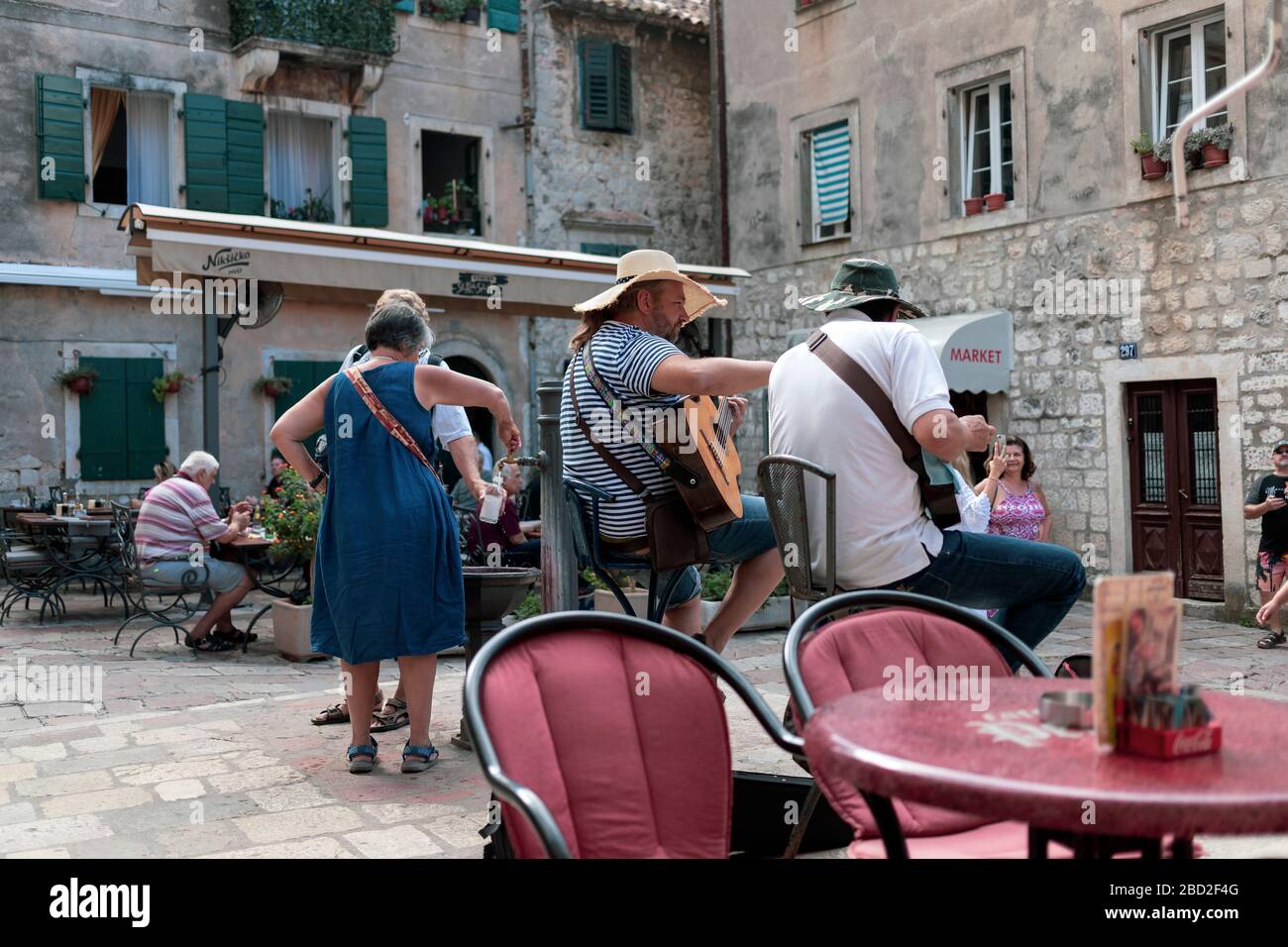 Montenegro, Sep 17, 2019: View from behind of two musicians playing ...