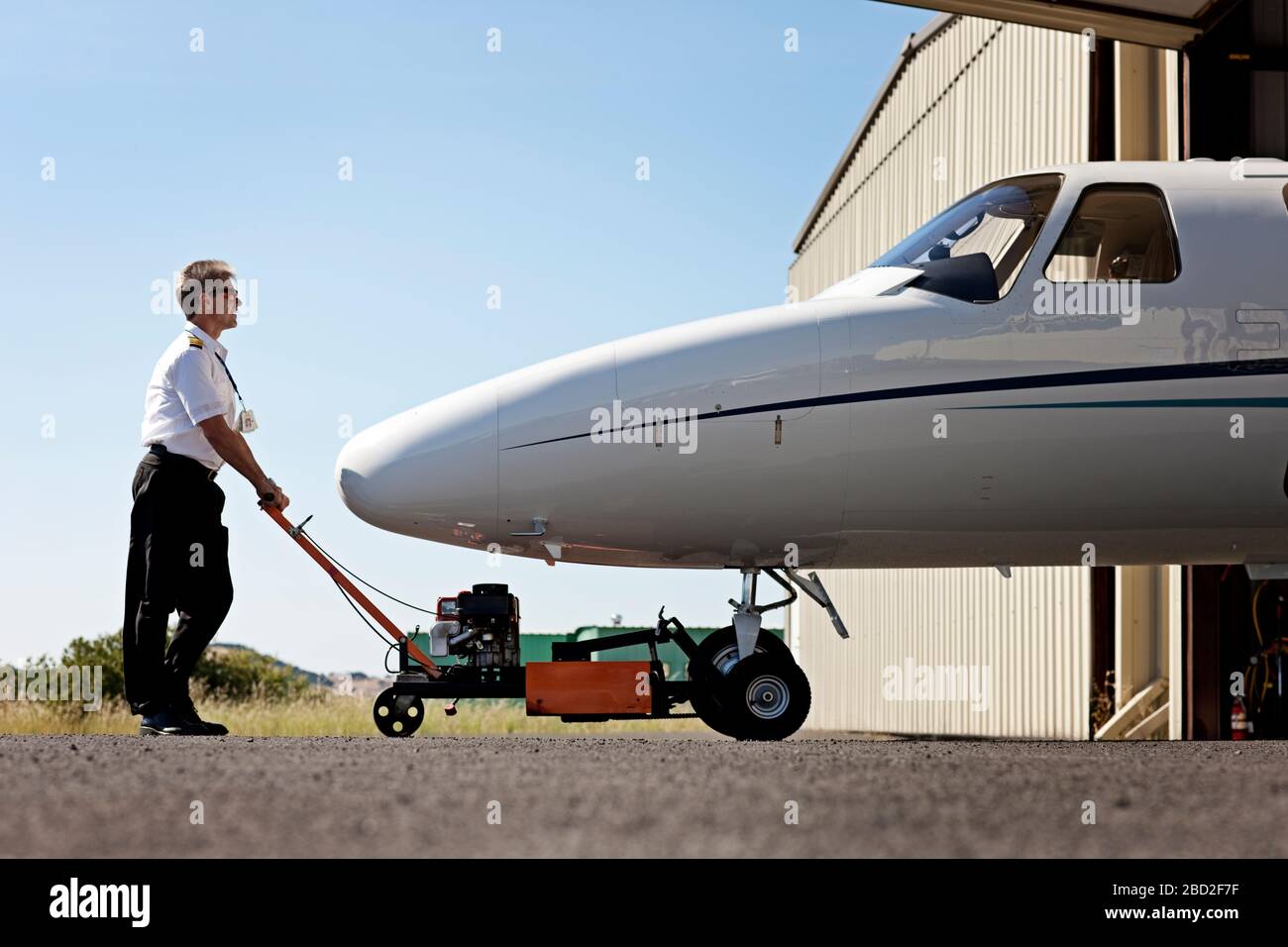 Pilot preparing a plane for take off Stock Photo - Alamy