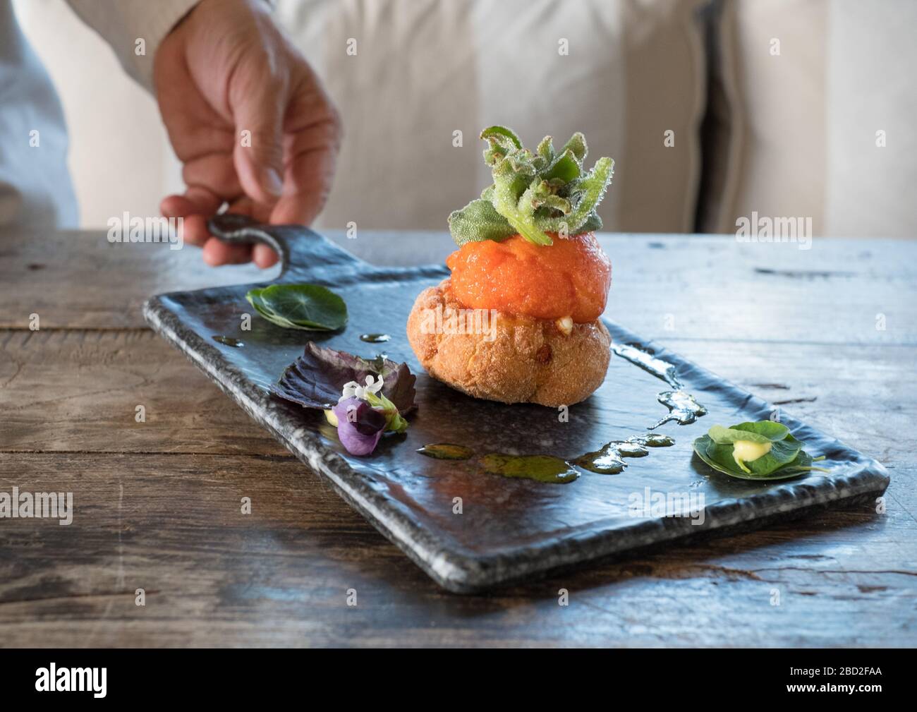 Chef Giannis Baxevanis' feta-stuffed donut topped with Florina red ...