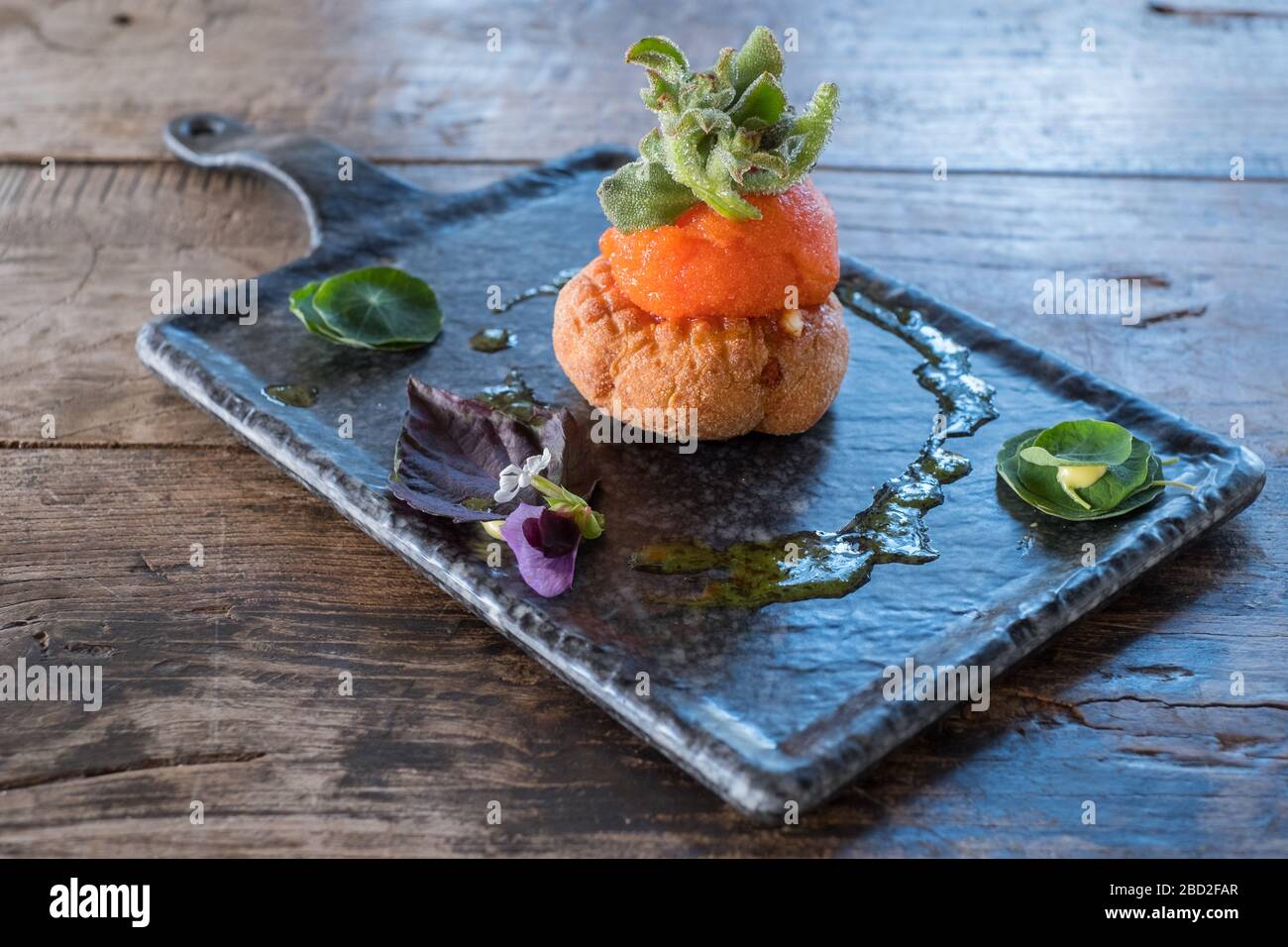 Chef Giannis Baxevanis' feta-stuffed donut topped with Florina red ...
