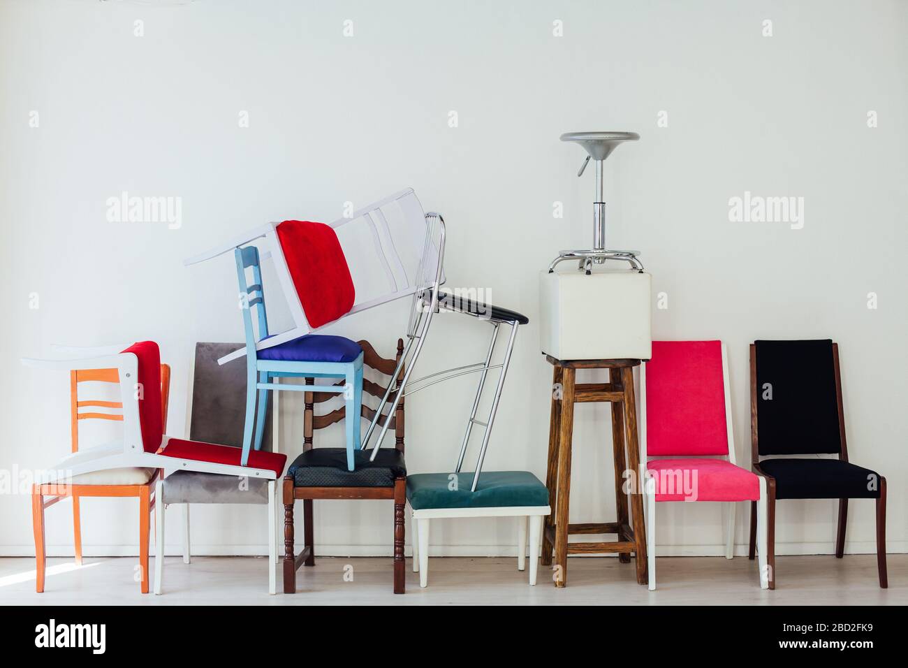 lots of multicolored chairs in the interior of the white room Stock ...