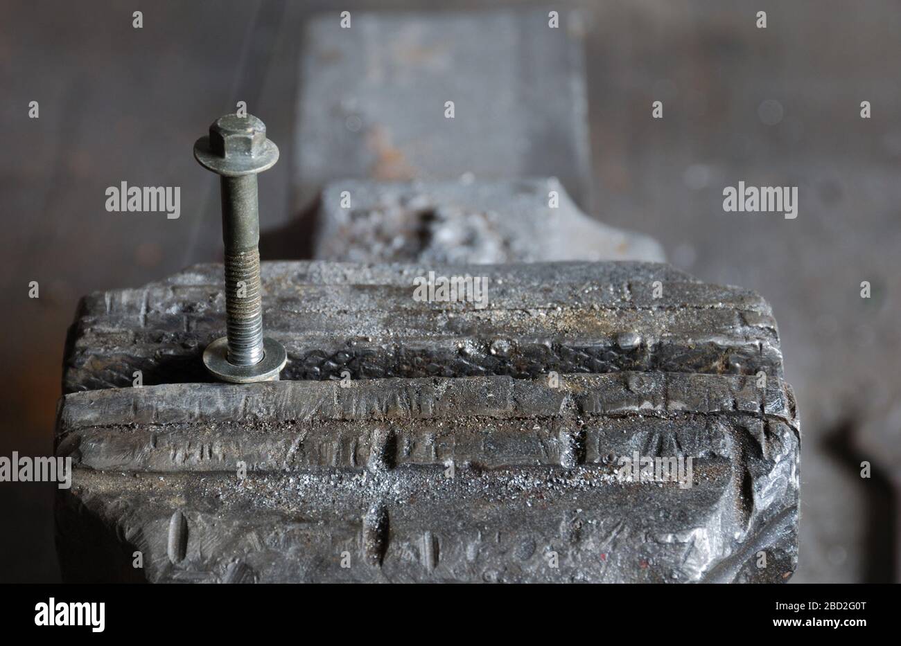 Old screw in ancient vise. Close-up view Stock Photo - Alamy