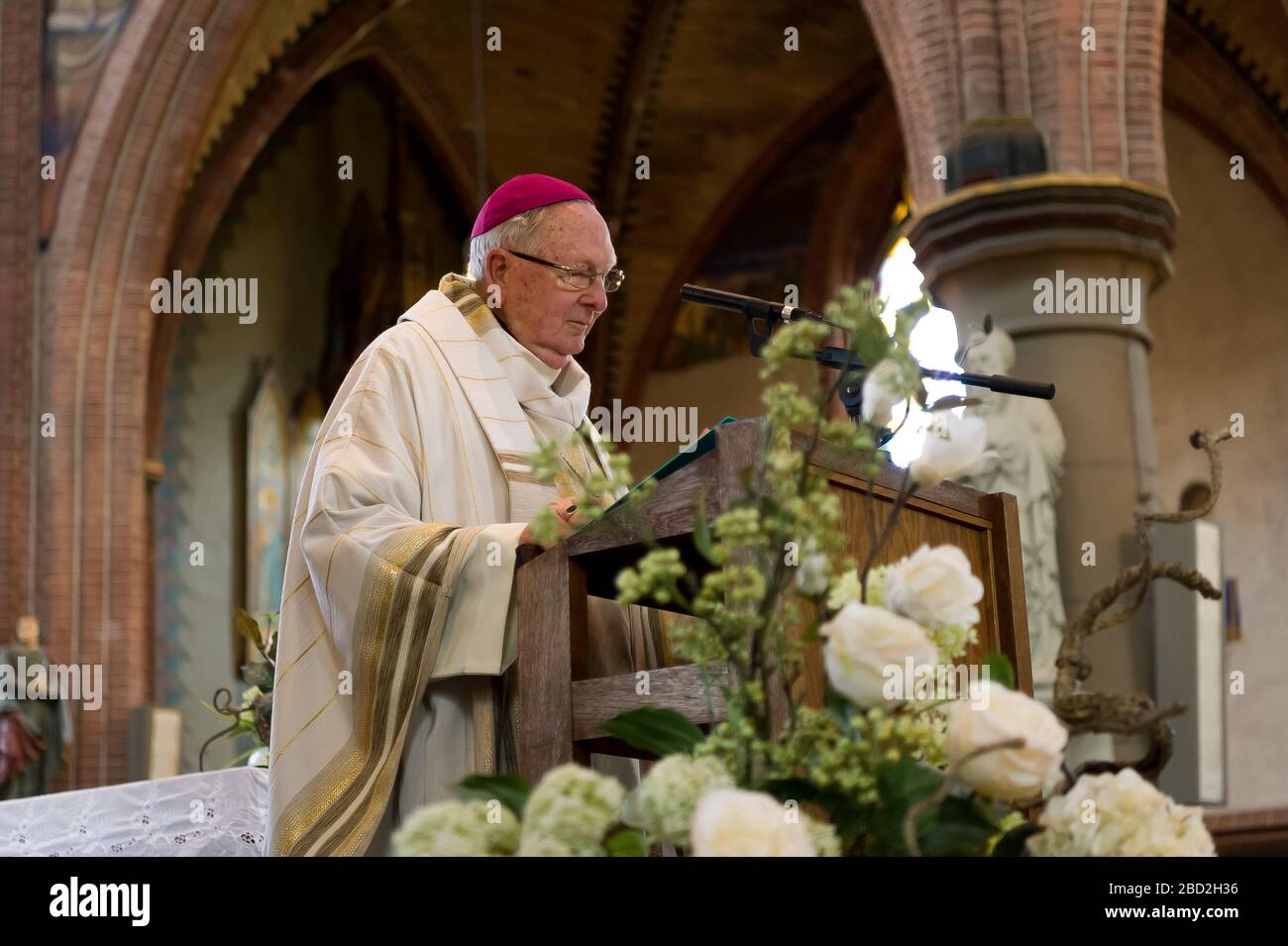Bishop at the altar inside of a catholic church Stock Photo - Alamy