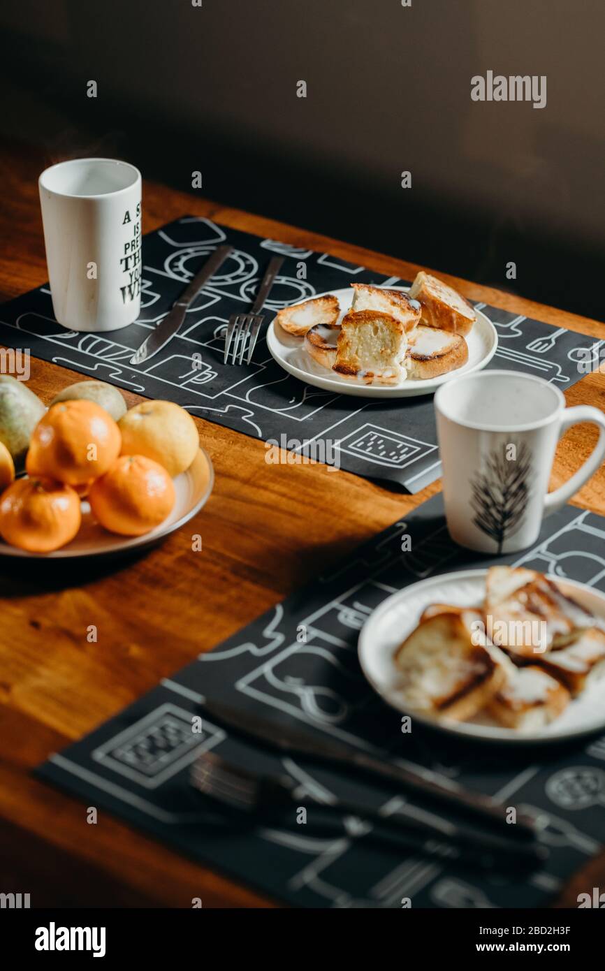 Breakfast setting for two people - Coffee, Tea, Breads and fruits Stock ...