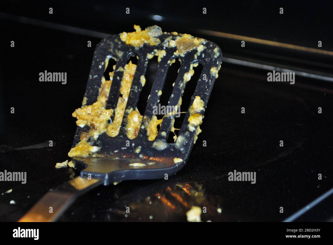 Dirty spatula sitting on the stove after making breakfast Stock Photo ...