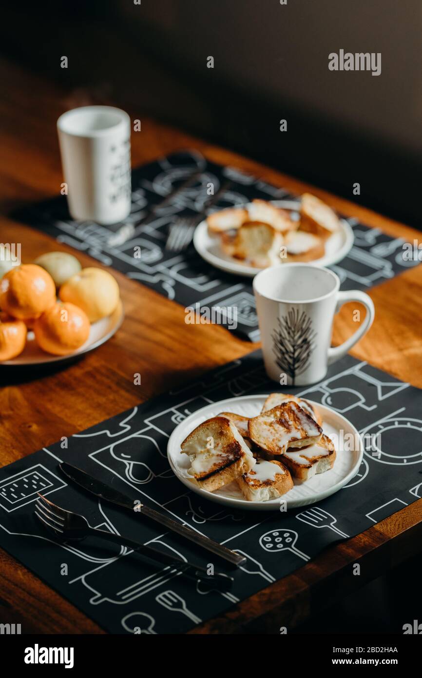 Breakfast setting for two people - Coffee, Tea, Breads and fruits Stock ...