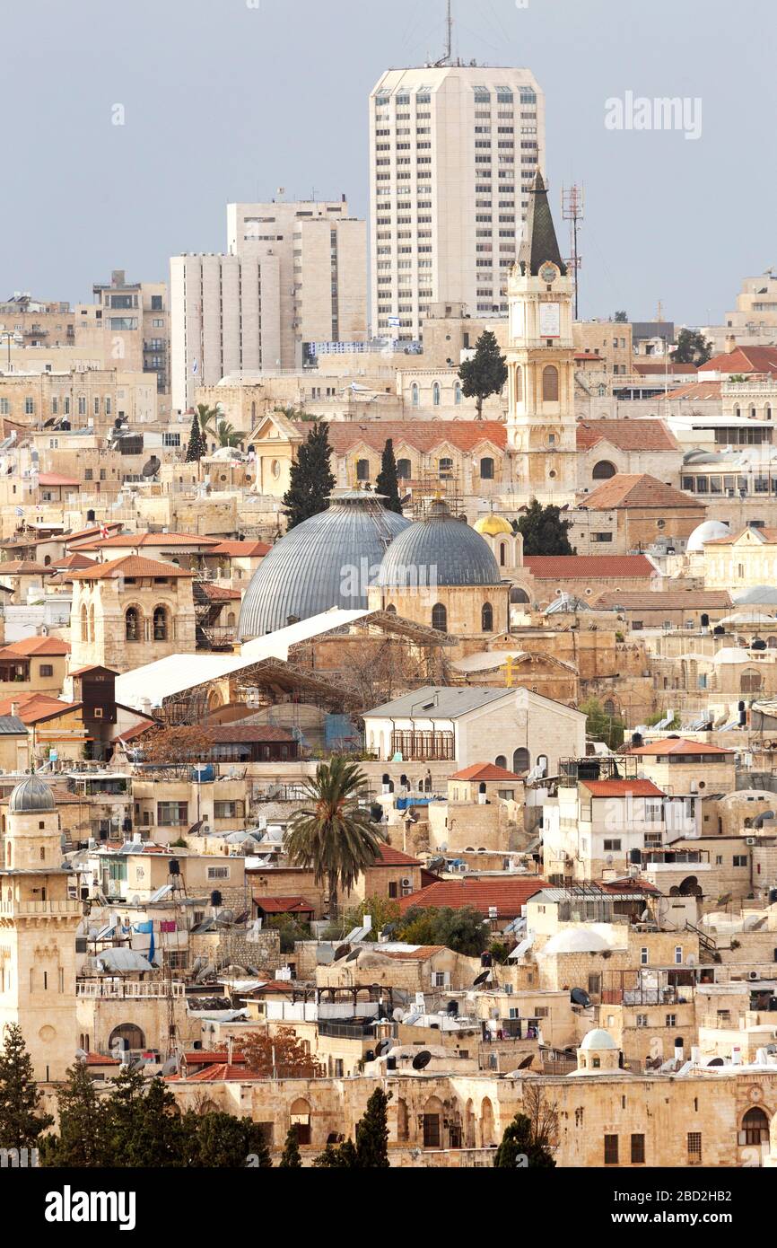 Domes of the Church of the Holy Sepulchre stand among buildings in the ...