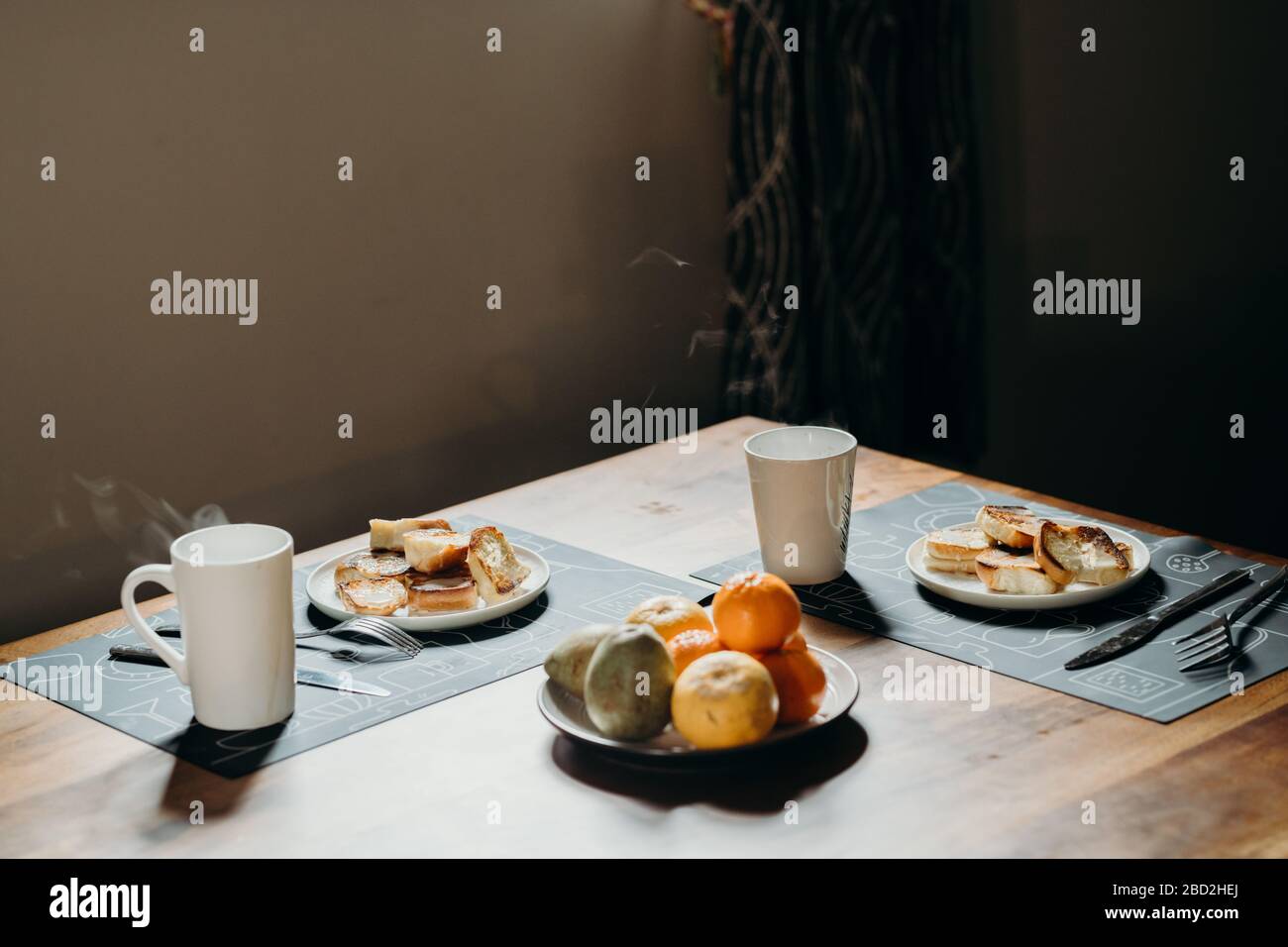 Breakfast setting for two people - Coffee, Tea, Breads and fruits Stock ...
