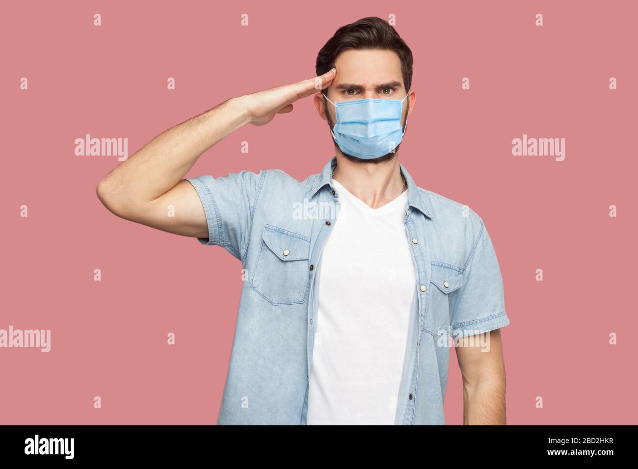 Yes sir. Portrait of serious young man with surgical medical mask in ...