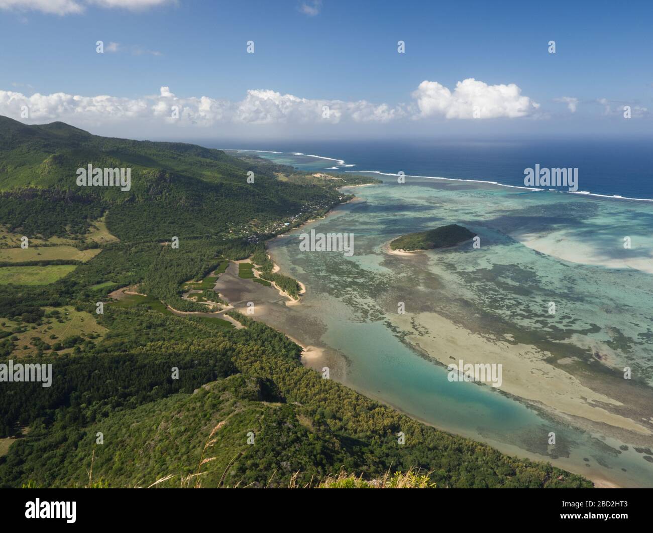 Turquoise lagoon view with the coast and the mountain in Mauritius ...