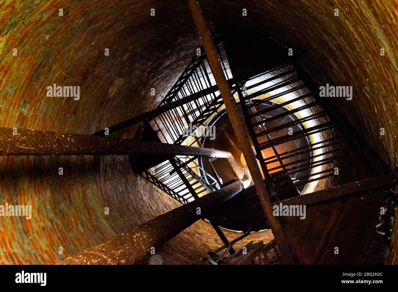 Rusty water tower inside view from top to bottom. Old water pump ...