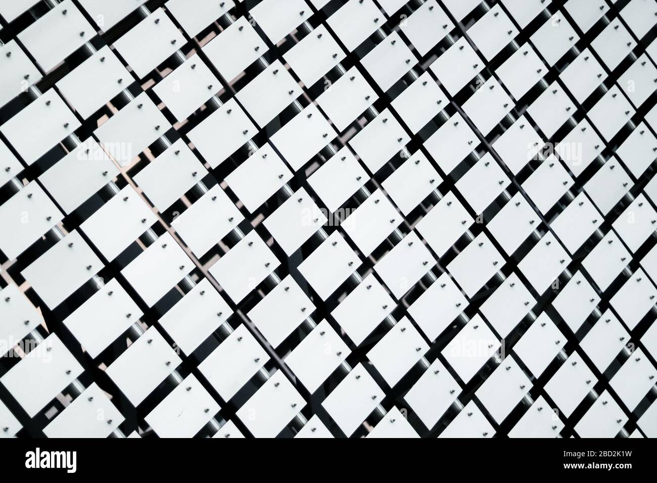 Kinetic facade of the building. Metal plates in brushed stainless steel ...