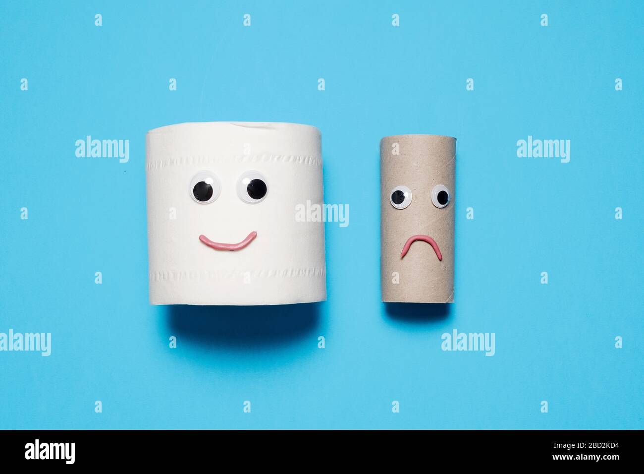 Happy smiling full roll of toilet paper next to sad empty roll with ...
