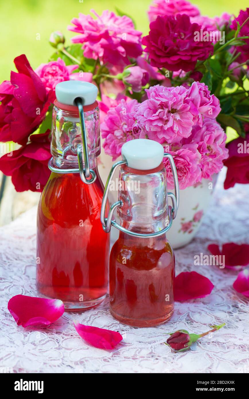 Rose water with fresh roses Stock Photo - Alamy