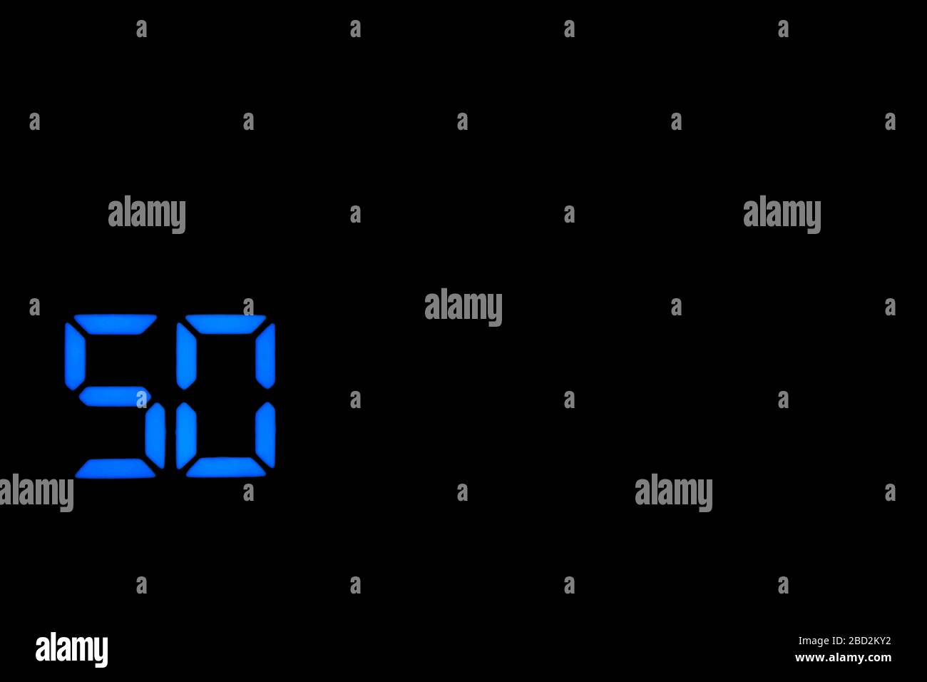 Electronic numbers of 50 blue color on a black background Stock Photo ...