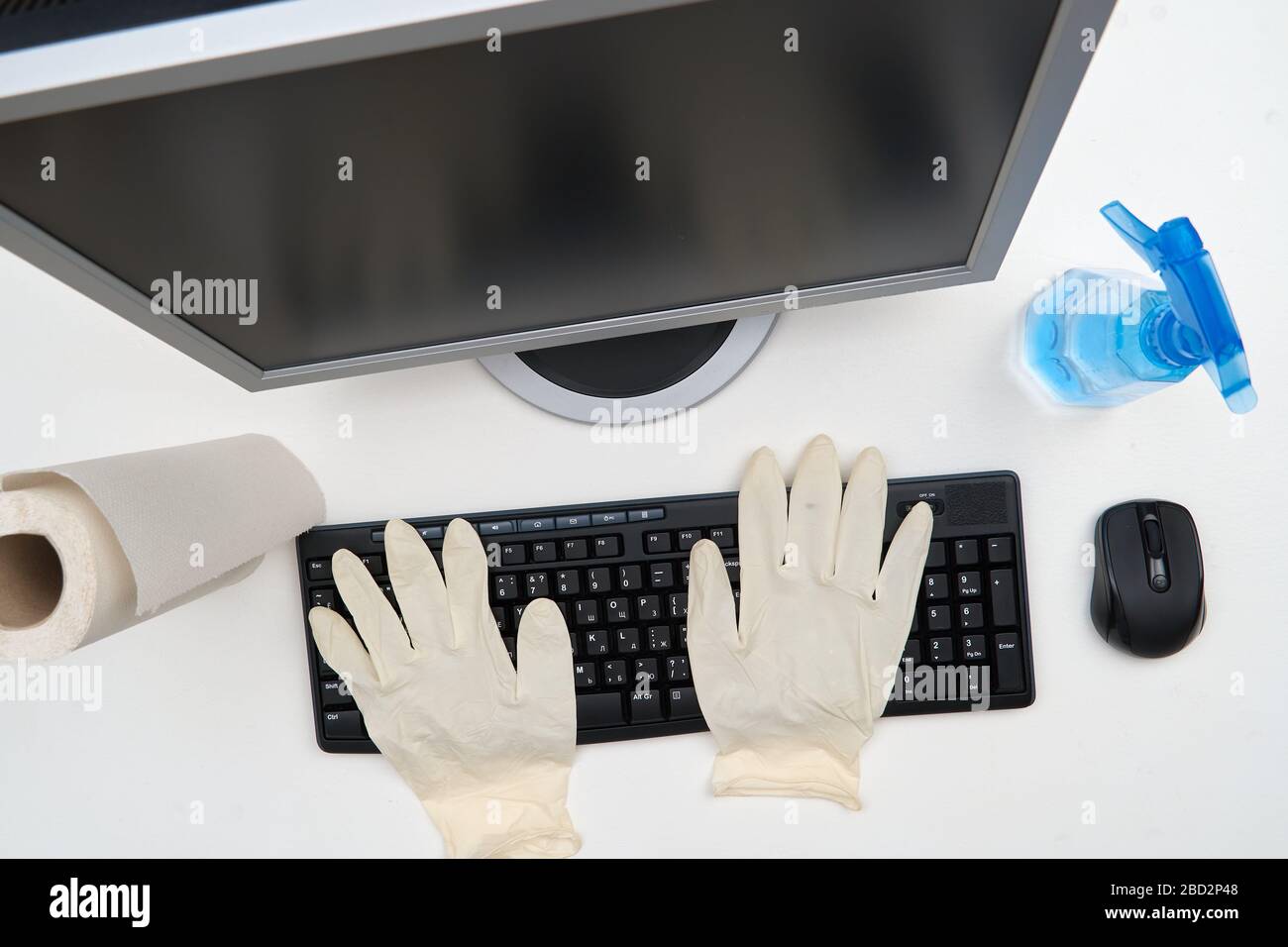 concept of cleaning or disinfecting the office - a businessman cleans ...