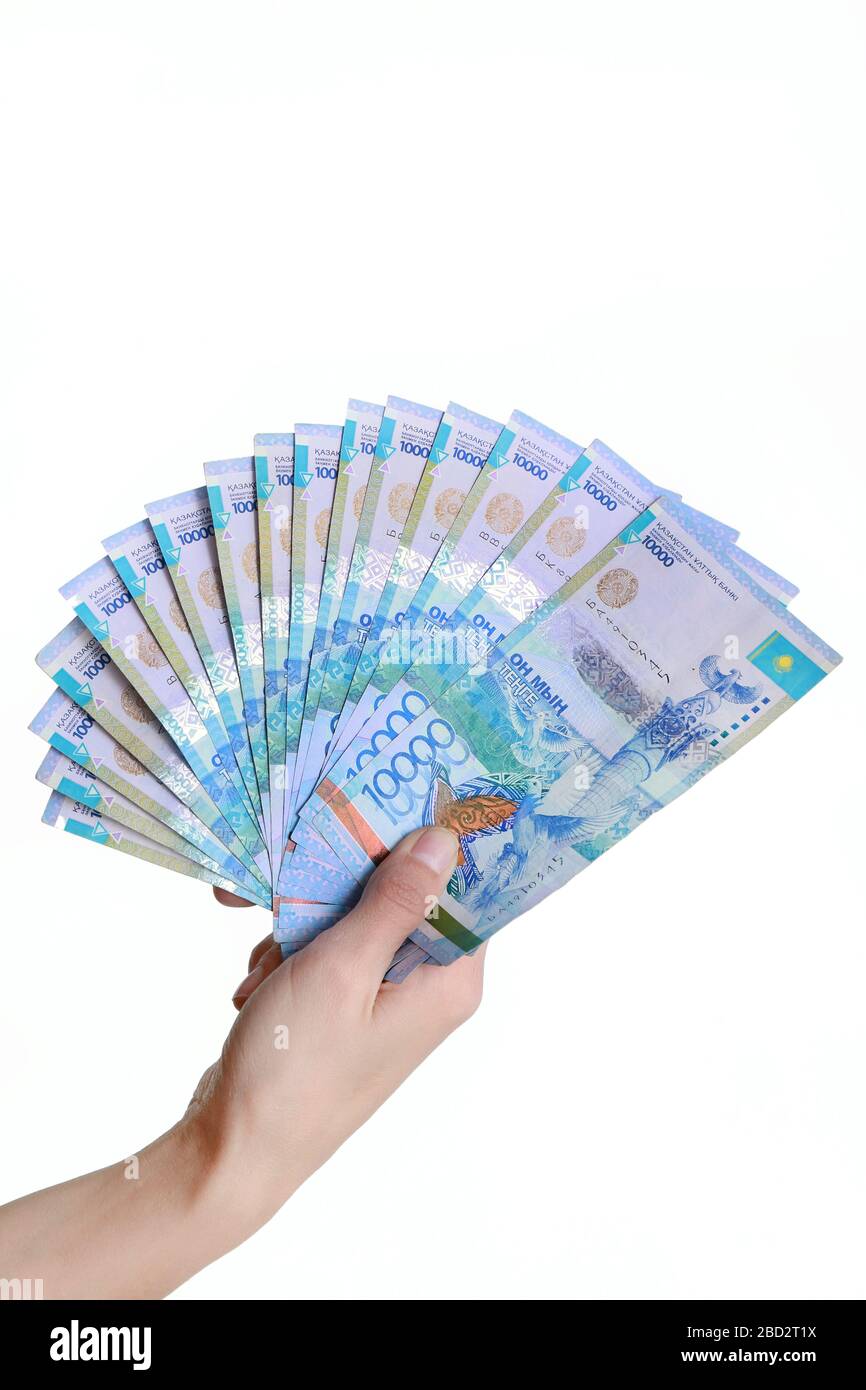 Tenge National currency of Kazakhstan in hand. Isolated on white ...