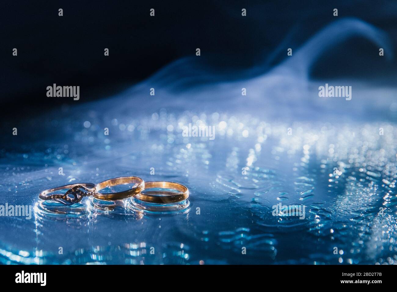 Wedding ring. Three gold rings: an engagement ring and an engagement ...