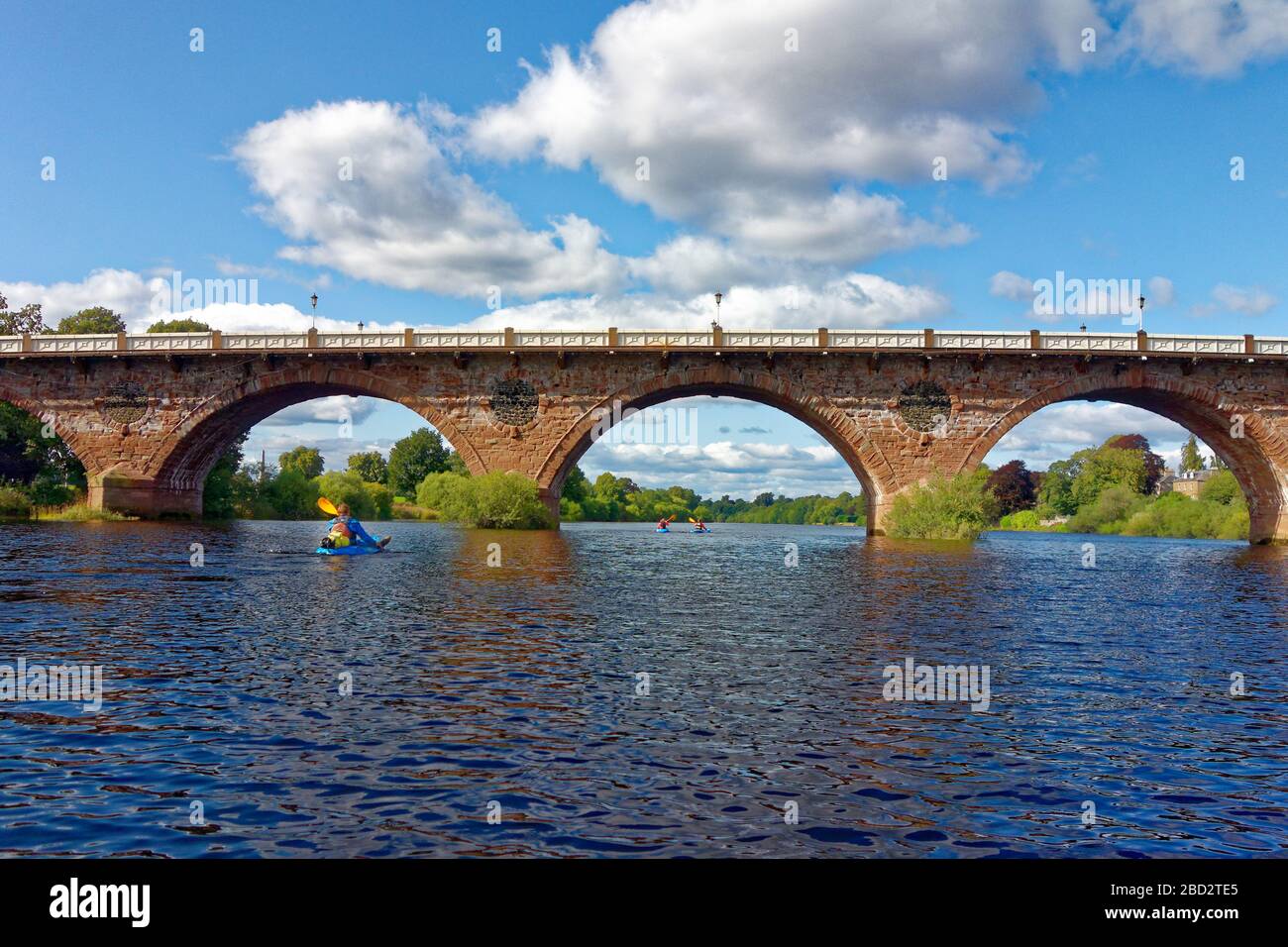 Kayakers pass under Perth Bridge on the River Tay, Perth, Scotland ...