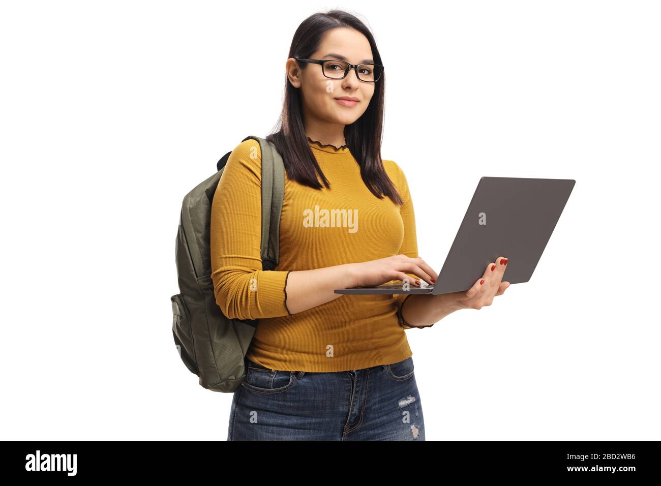 Female student posing with a laptop computer isolated on white ...
