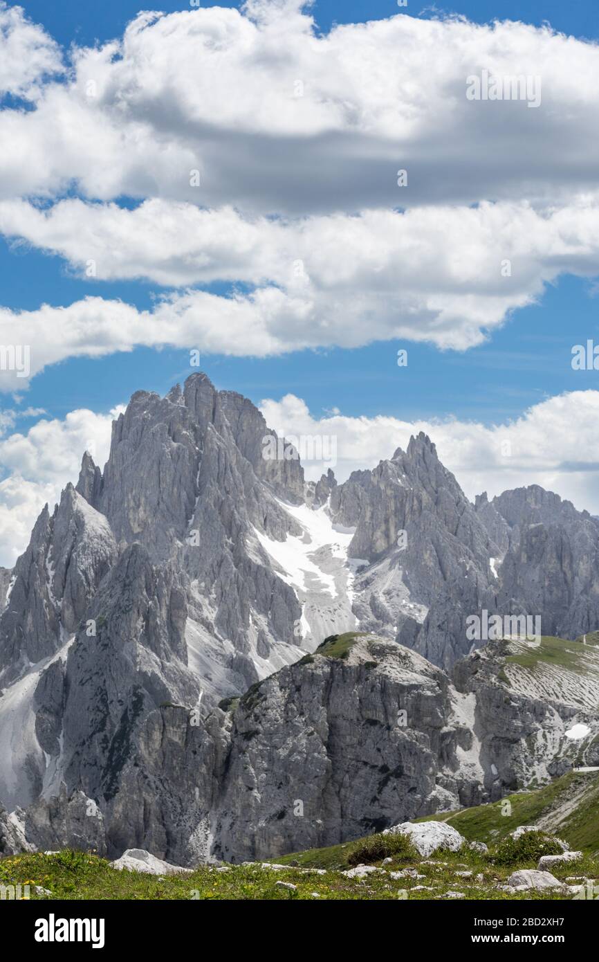 Close up of a range of alpine rocky peaks under a summer blue sky with ...