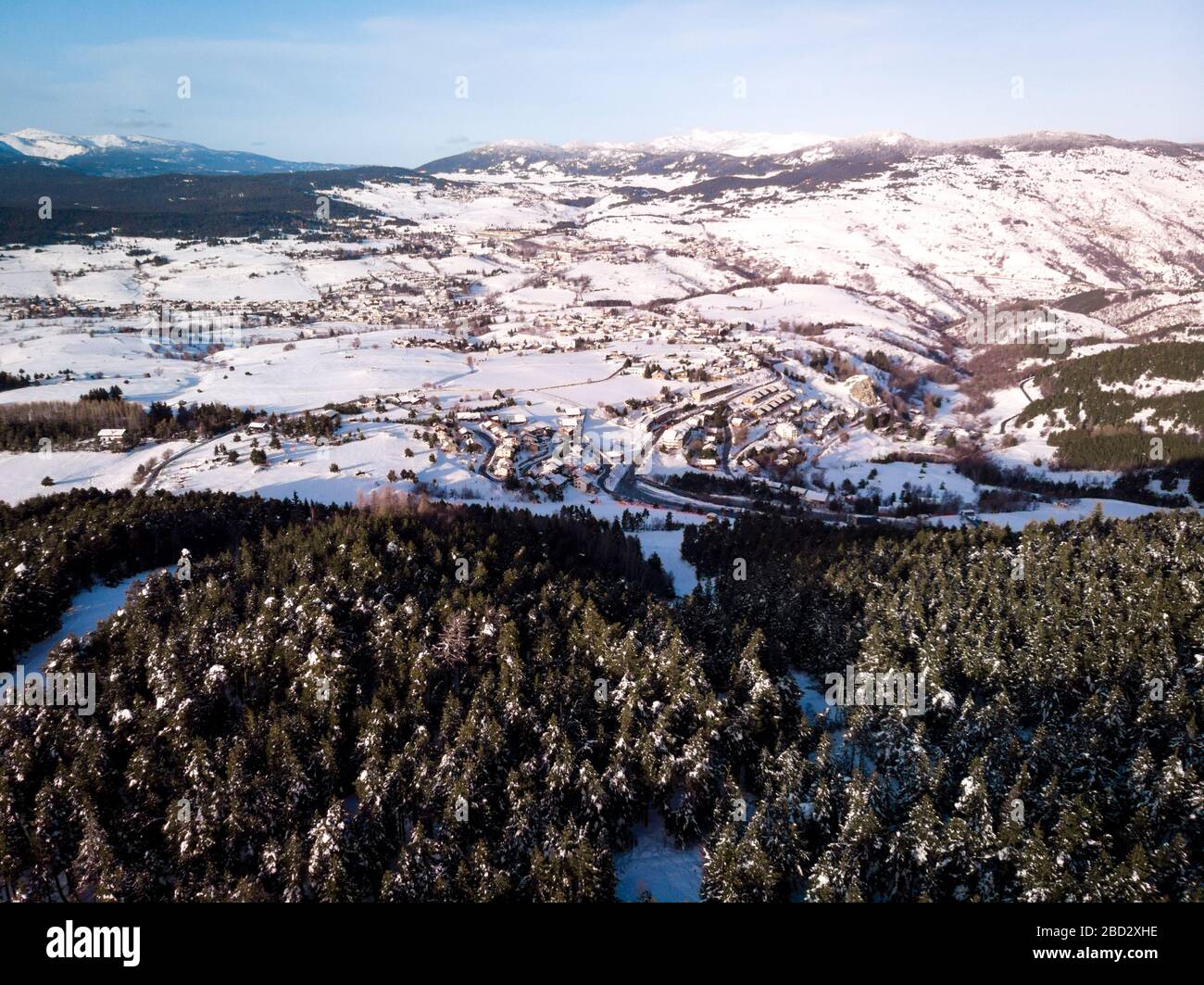 Aerial view of ski resort and snowy mountain in the pyrenees orientales ...