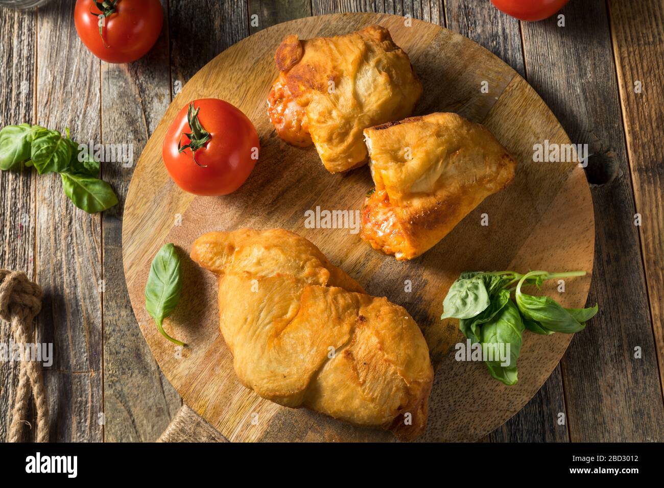 Homemade Italian Cheesy Panzerotti Calzone with Basil and Sauce Stock ...