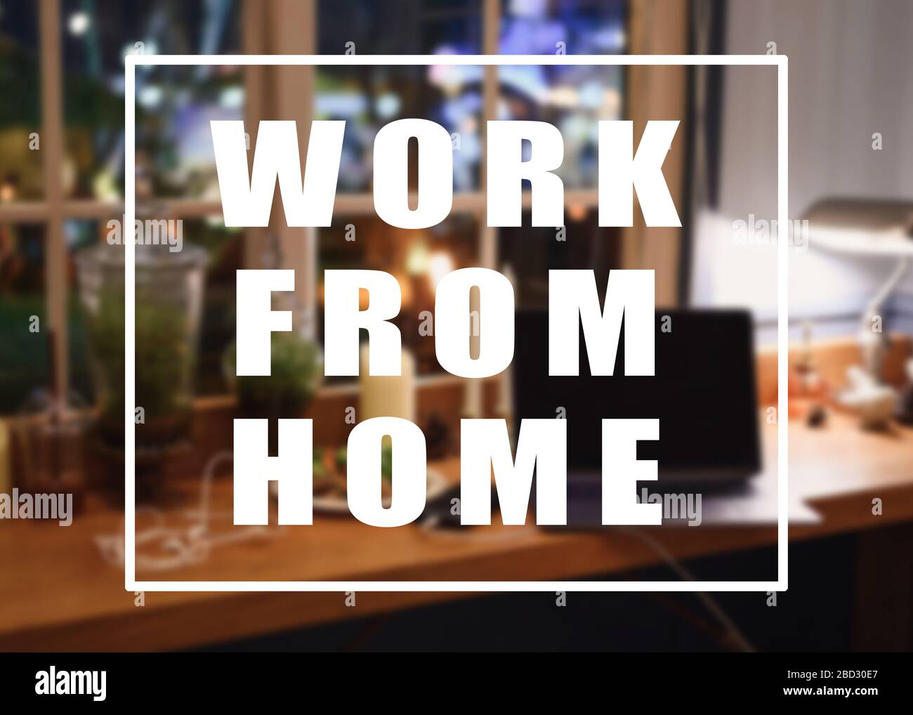 Work from home message concept. Laptop with flora decoration with ...