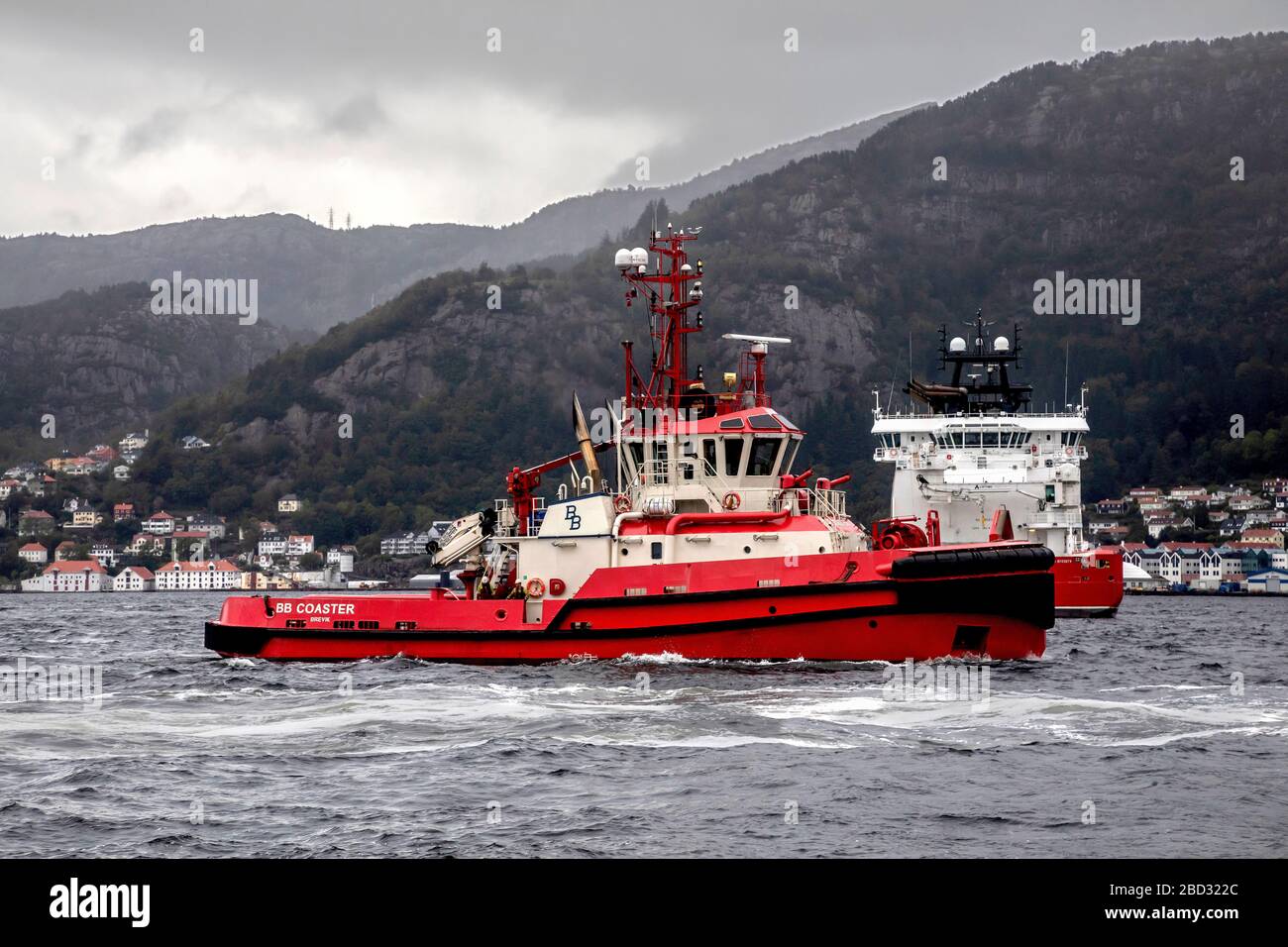 Tug boat BB Coaster assisting a large cruise ship to depart from the ...