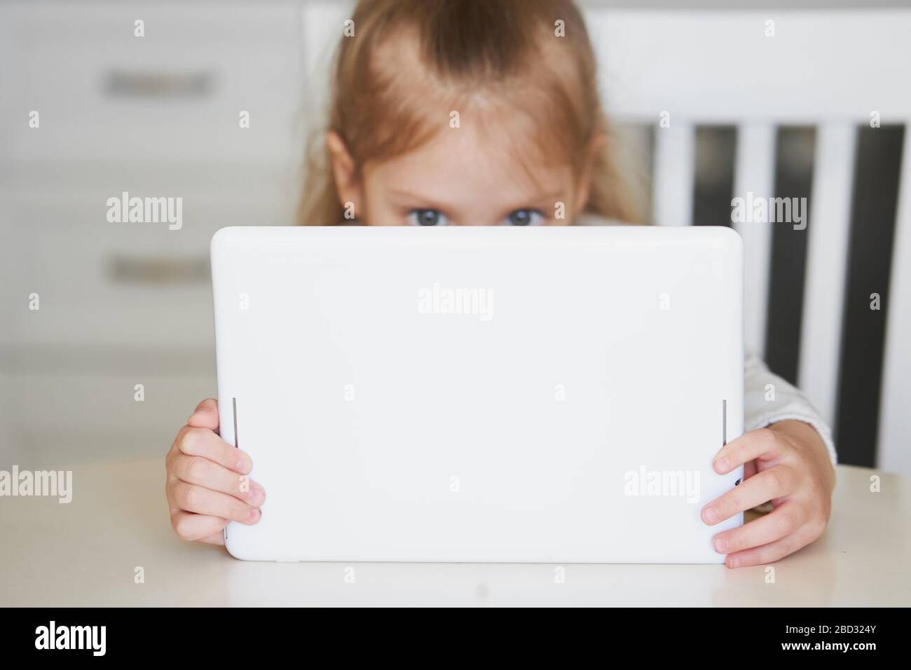 Online Education concept. Little child girl using laptop for distance ...
