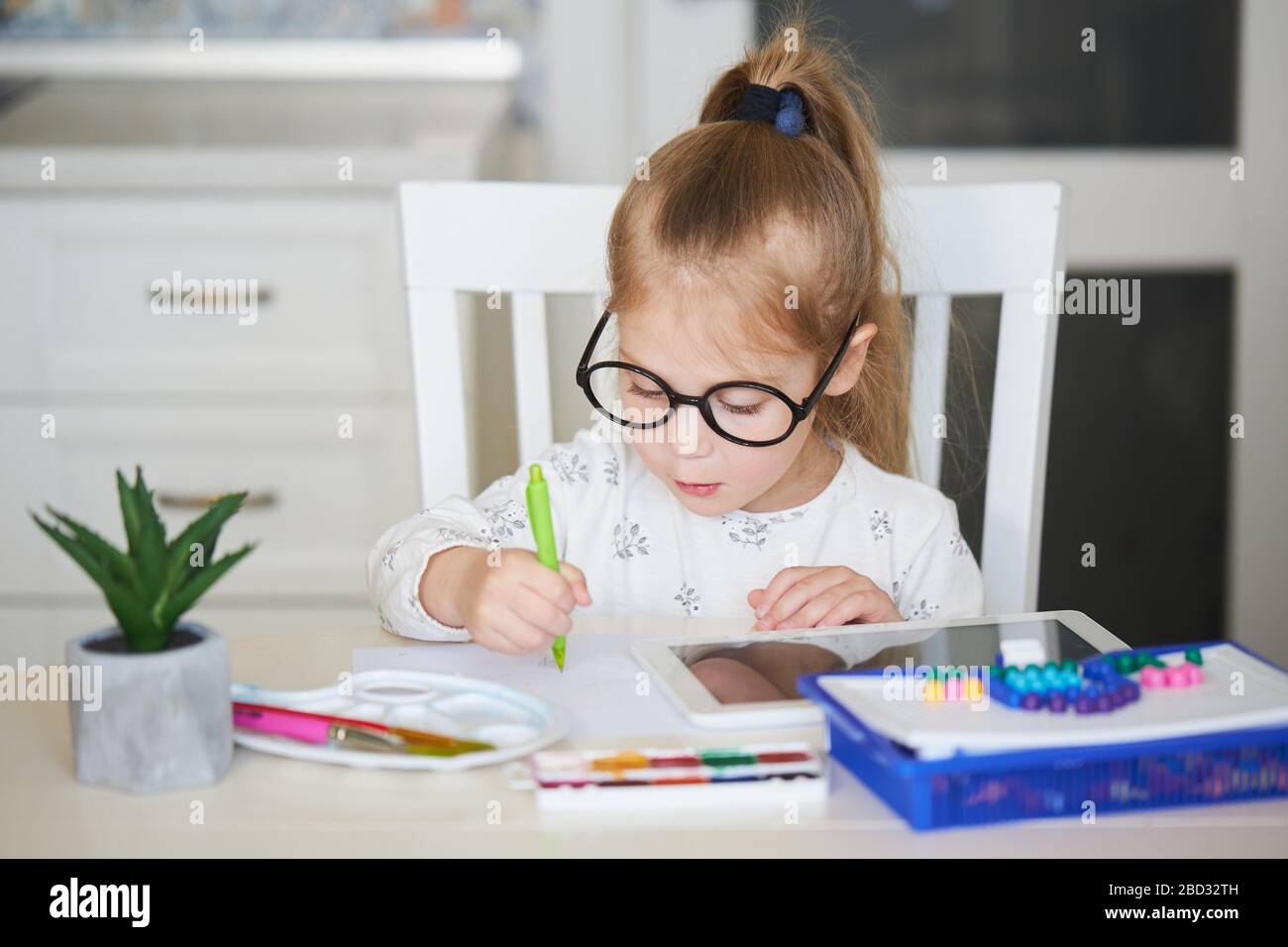 Online Education concept. Little child girl using laptop for distance ...