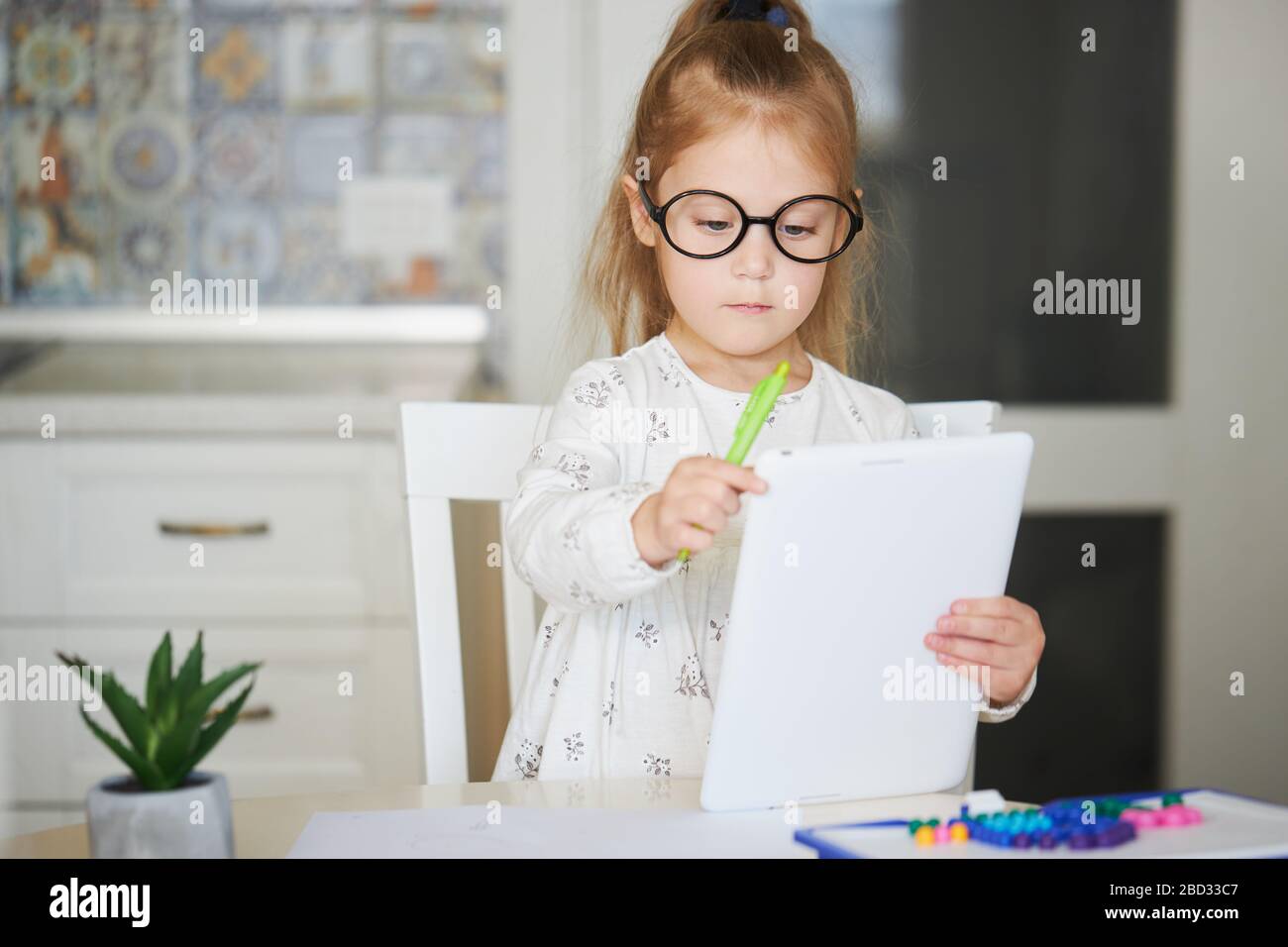 Online Education concept. Little child girl using laptop for distance ...