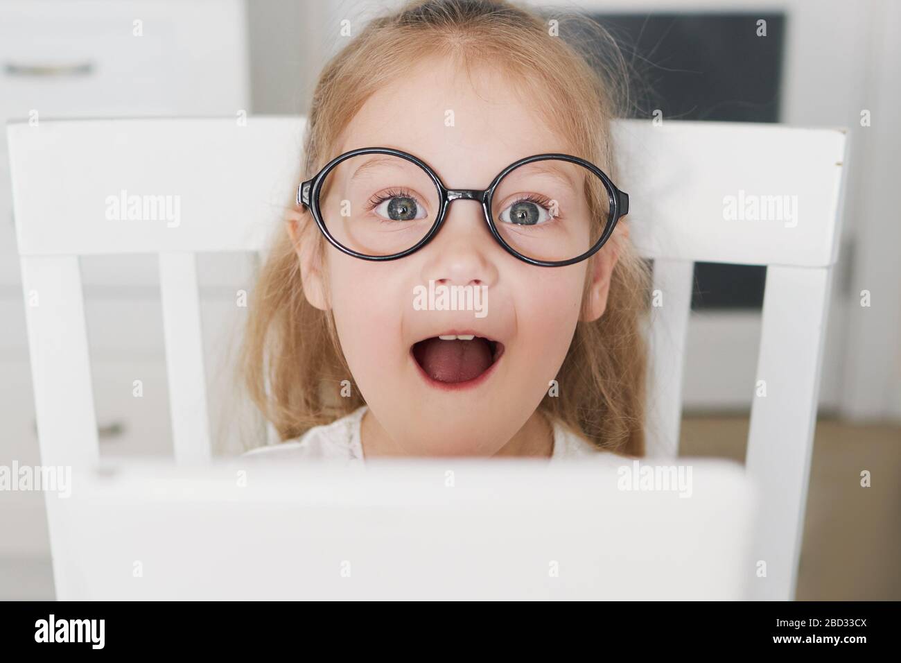 Online Education concept. Little child girl using laptop for distance ...