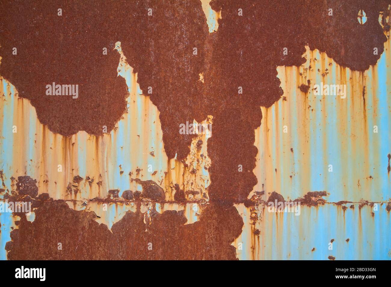 Multicolored background, rusty metal surface with blue paint flaking ...