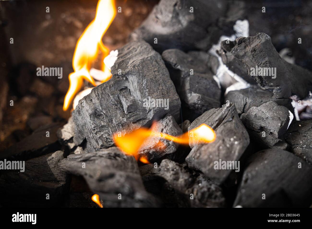 Barbecue coal is on fire Stock Photo - Alamy