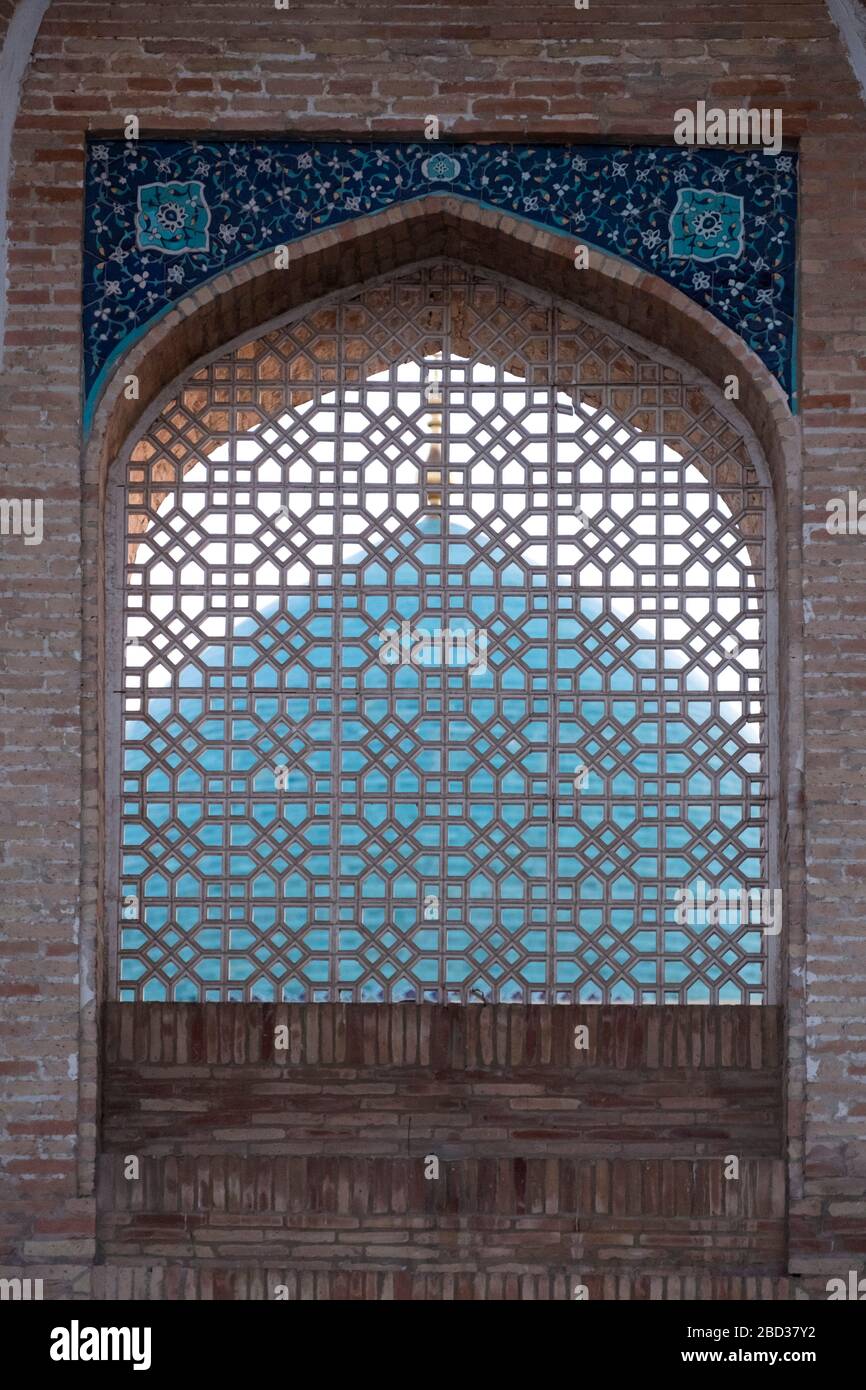Turquoise dome through a traditional Islamic screen at Hast Imam ...