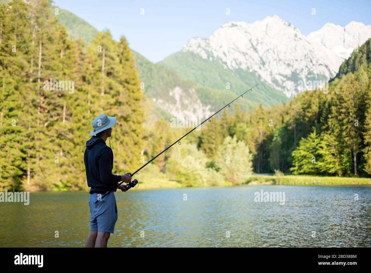 Sunset lake man casting fishing hi-res stock photography and images - Alamy