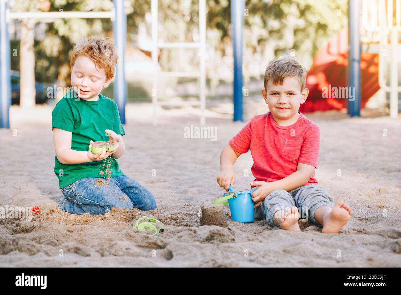 Two children playing sandbox hi-res stock photography and images - Alamy