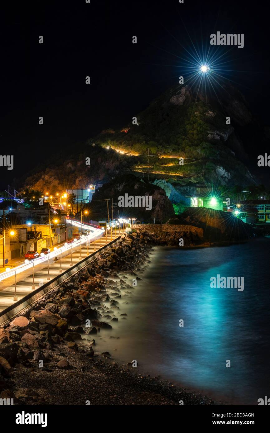 The road to the lighthouse lit up at night in Mazatlan, Sinaloa, Mexico ...