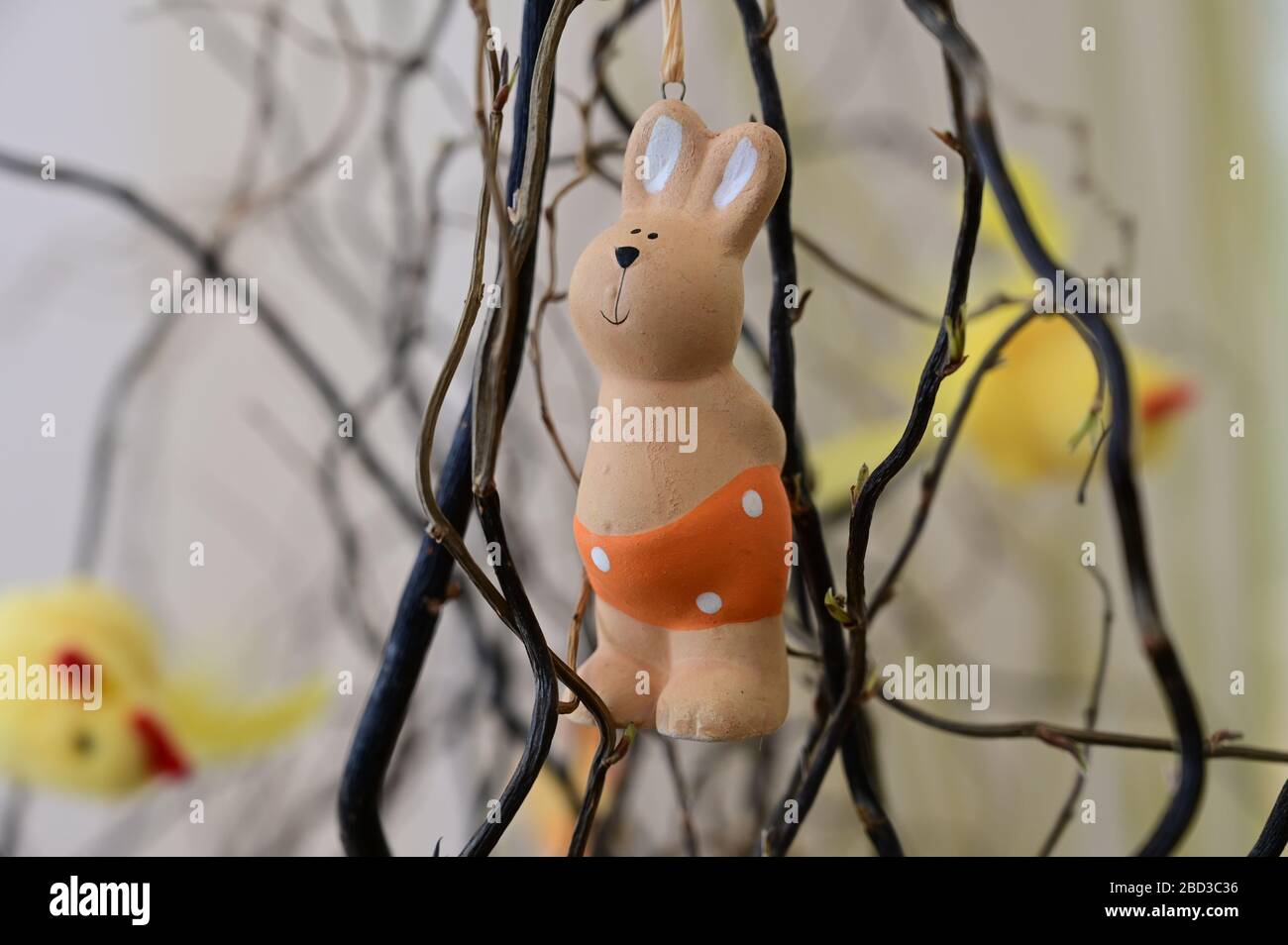 Clay Easter Bunny Hanging On Branches Stock Photo - Alamy