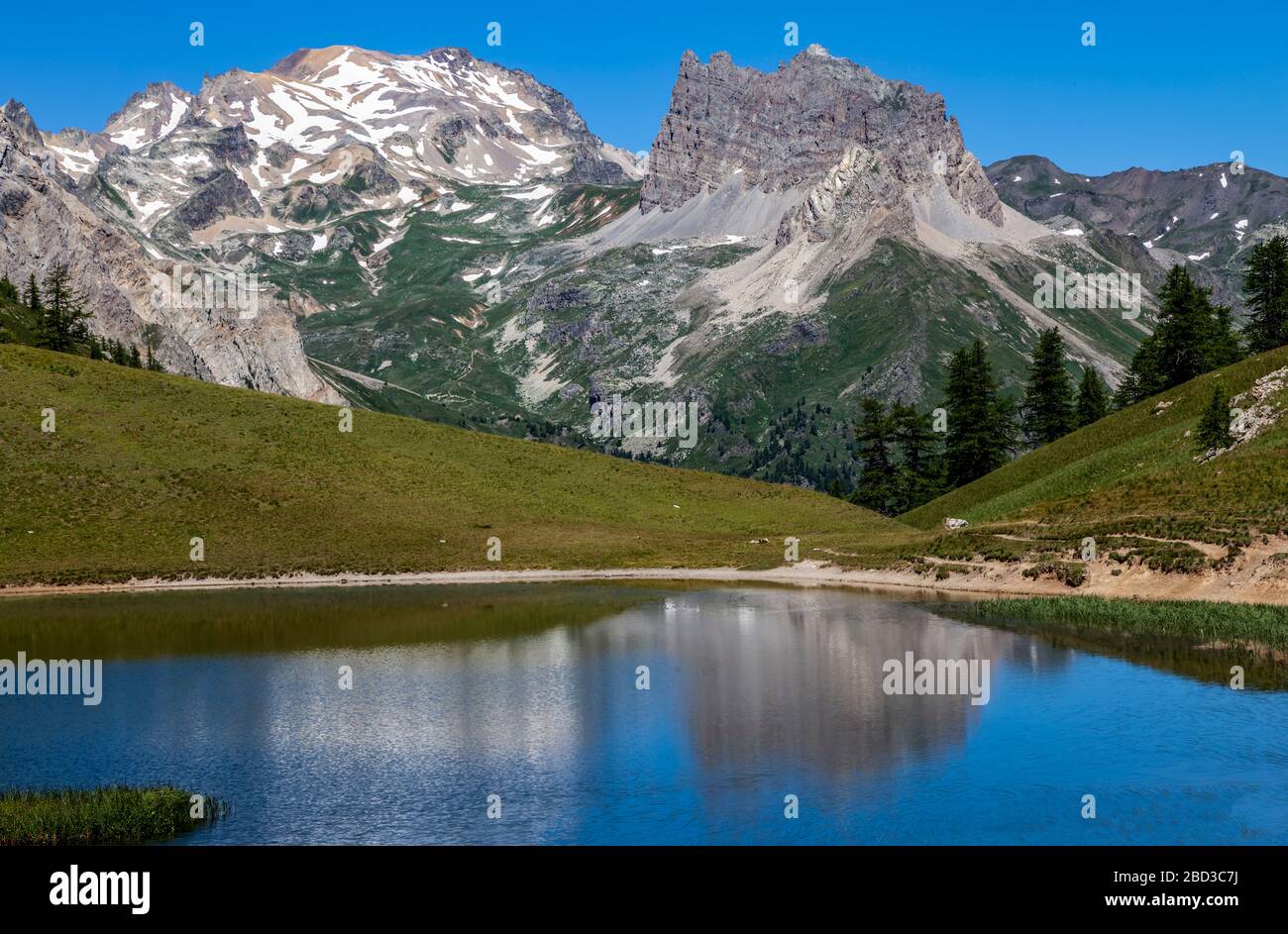 Mont Thabor and Le Grand Seru are reflected in the Lake Chavillon on ...