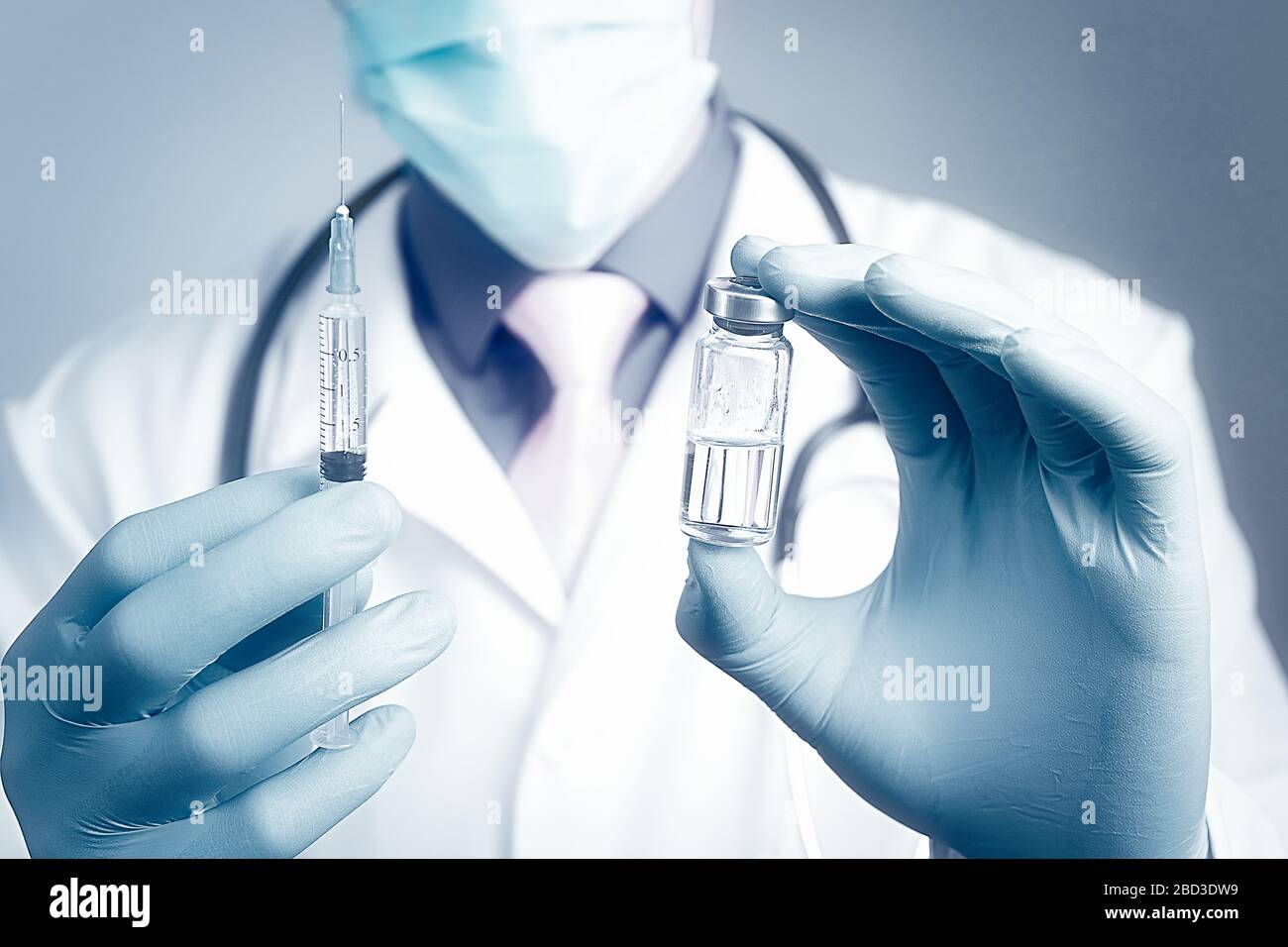 Close up doctor arm using syringe and ampoule, white robe dressed ...